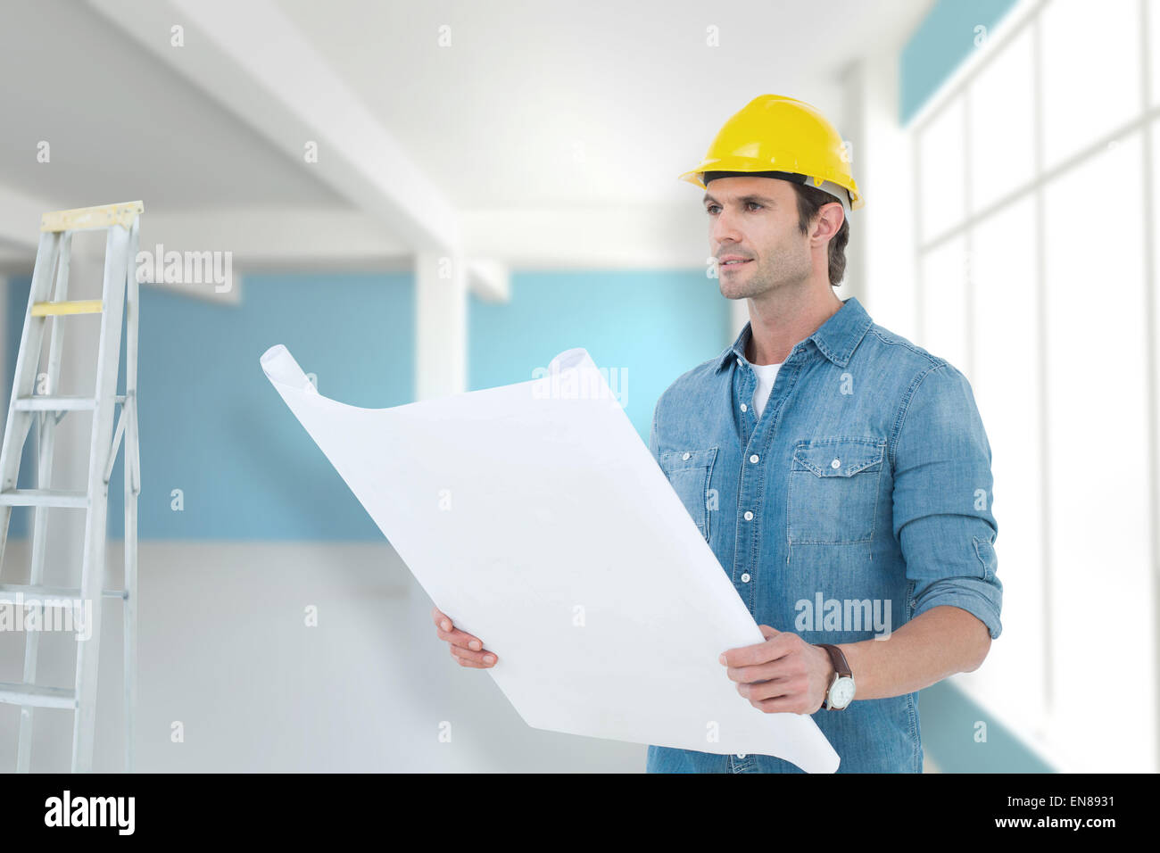 Composite image of architect holding blueprint in house Stock Photo - Alamy