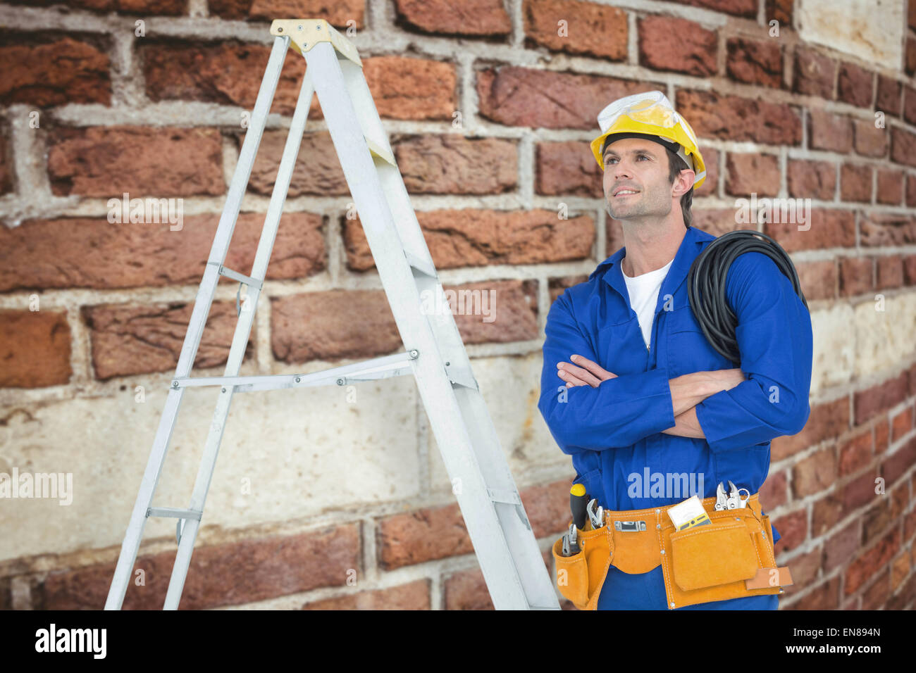 Composite image of thoughtful electrician with arms crossed by ladder ...