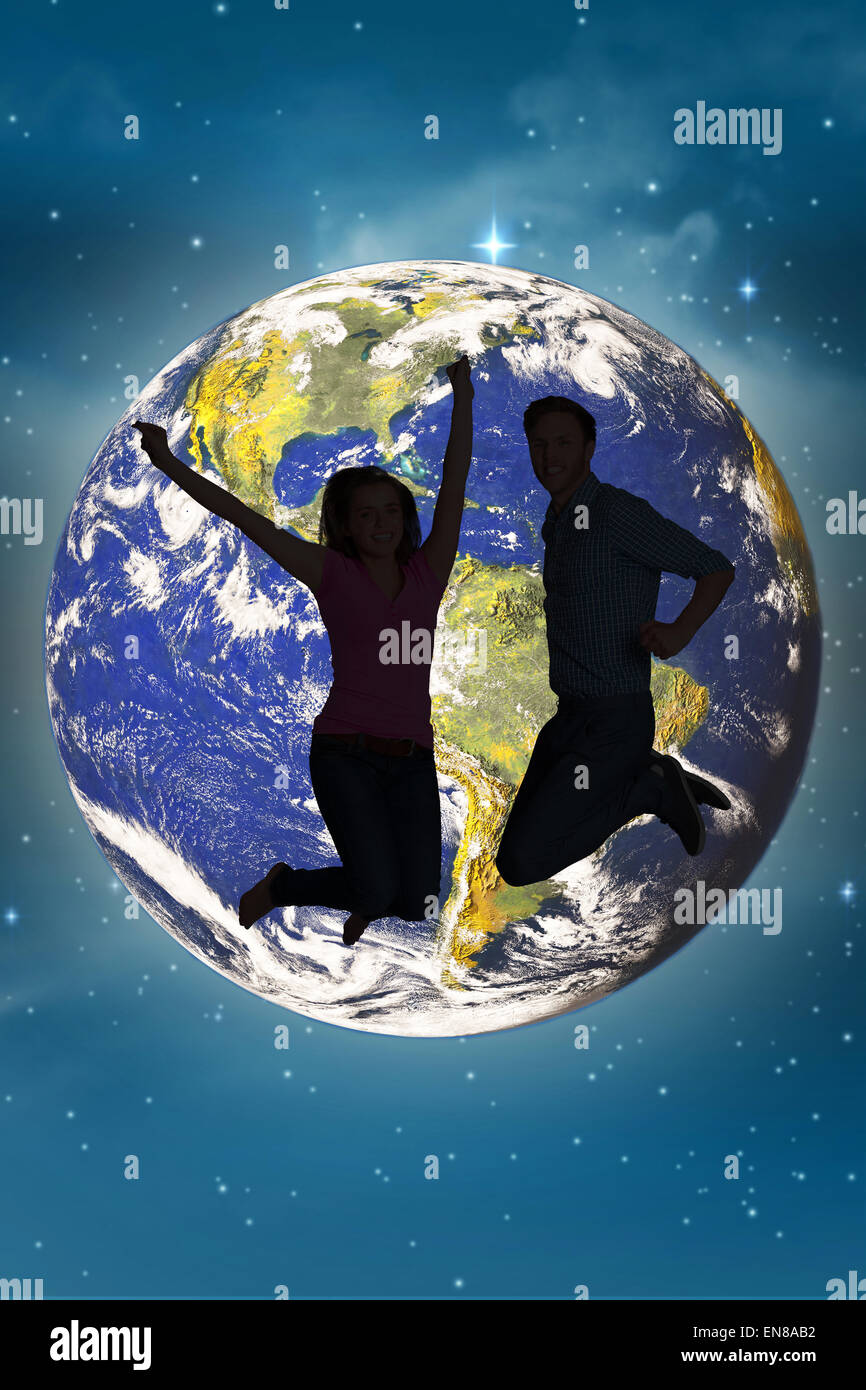 Composite image of cheerful young couple jumping Stock Photo - Alamy
