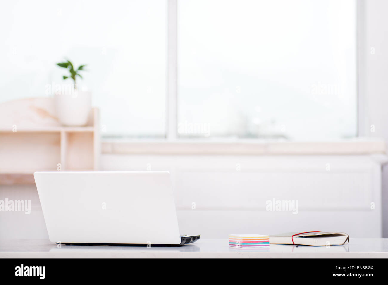 Office table with laptop and multicolored stickers Stock Photo - Alamy
