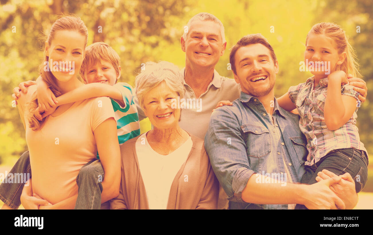 Portrait of an extended family at park Stock Photo - Alamy