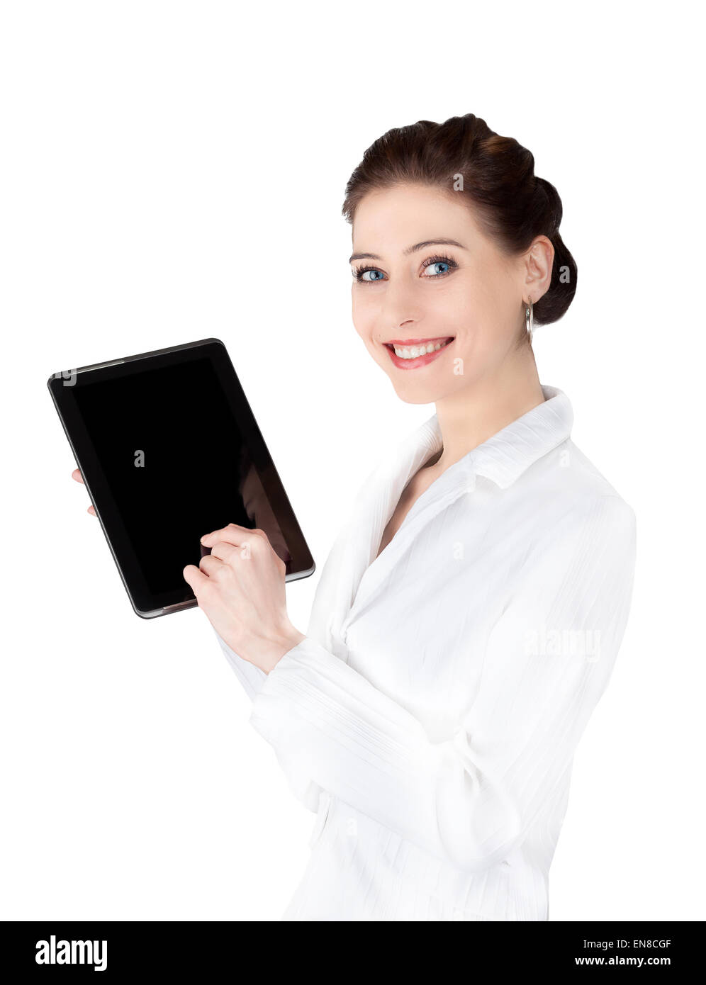 Portrait of a young woman pointing at tablet computer, isolated on ...
