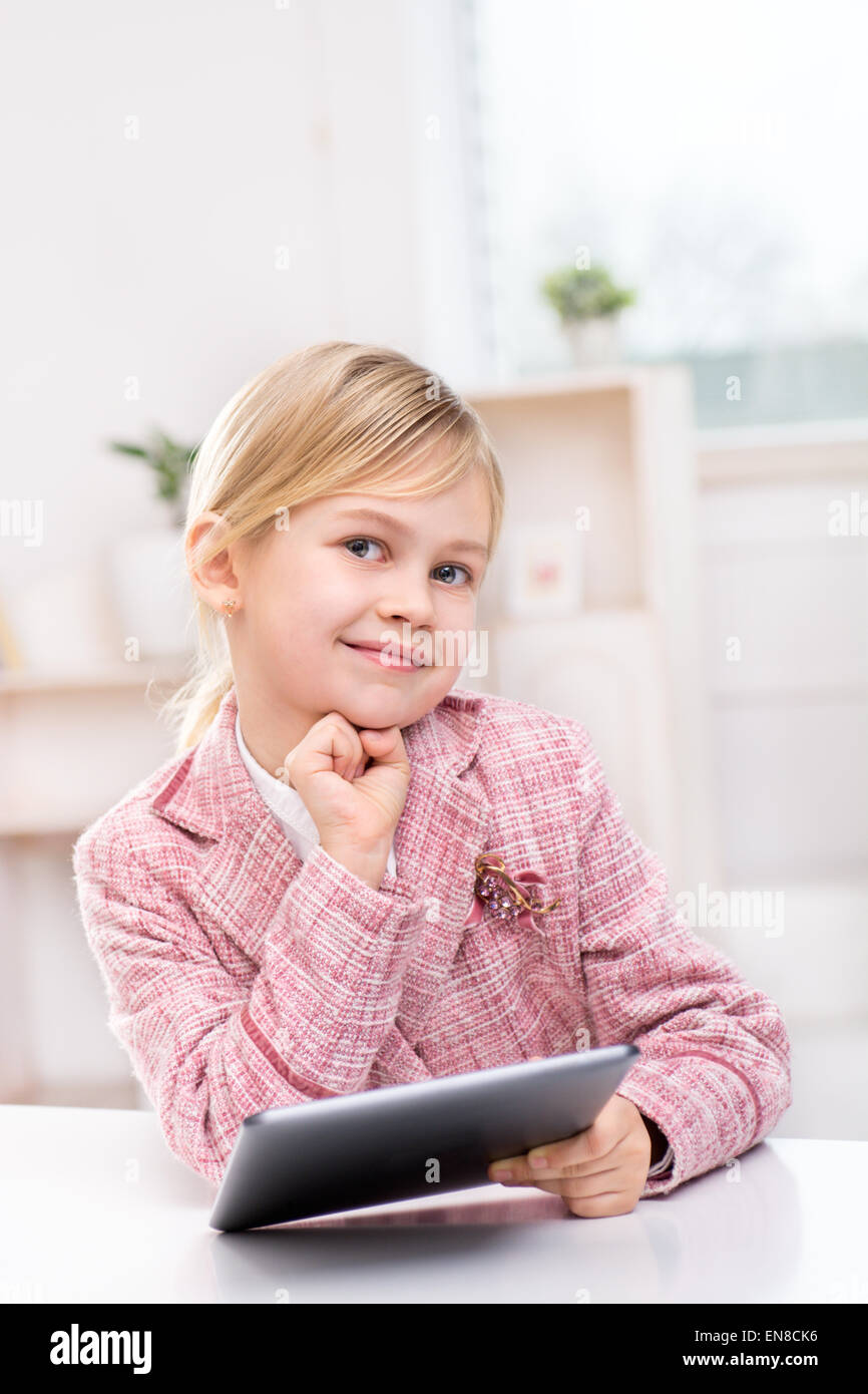 Little girl using tablet computer Stock Photo - Alamy