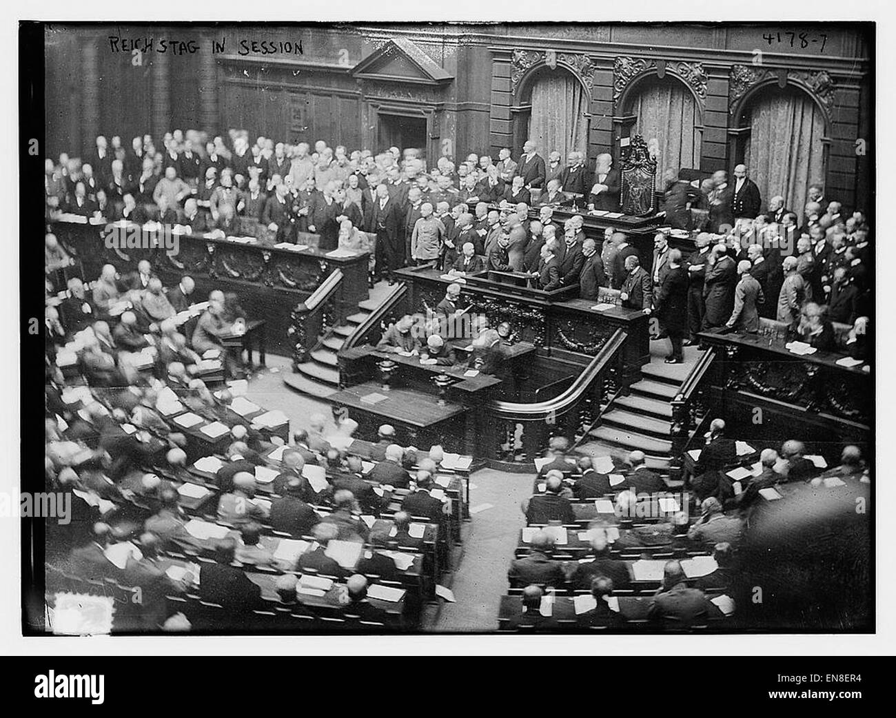 This historic image shows the Reichstag in session, the legislative ...