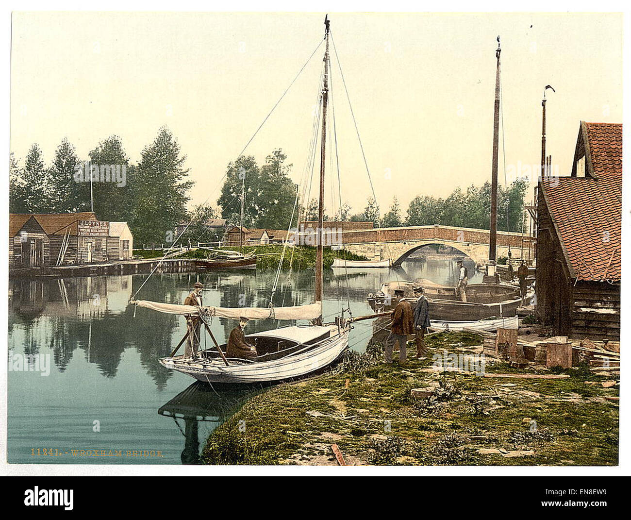 This image depicts a scenic bridge in Wroxham, England. Wroxham is ...