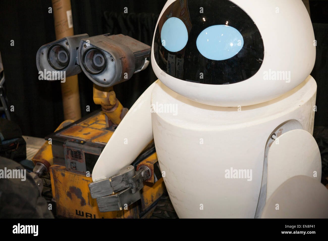 Eva and Wall-E from the movie Wall-E roam the convention floor at Stan ...