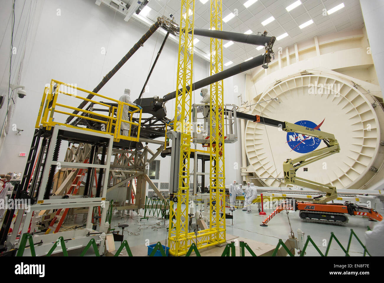 Engineers at NASA's Johnson Space Center manually deploy the secondary ...