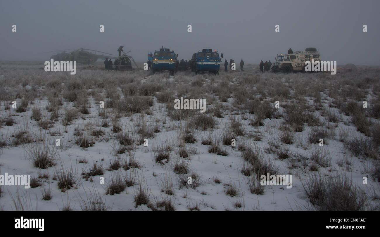 Expedition 42 astronauts Barry Wilmore, Alexander Samokutyaev, and ...