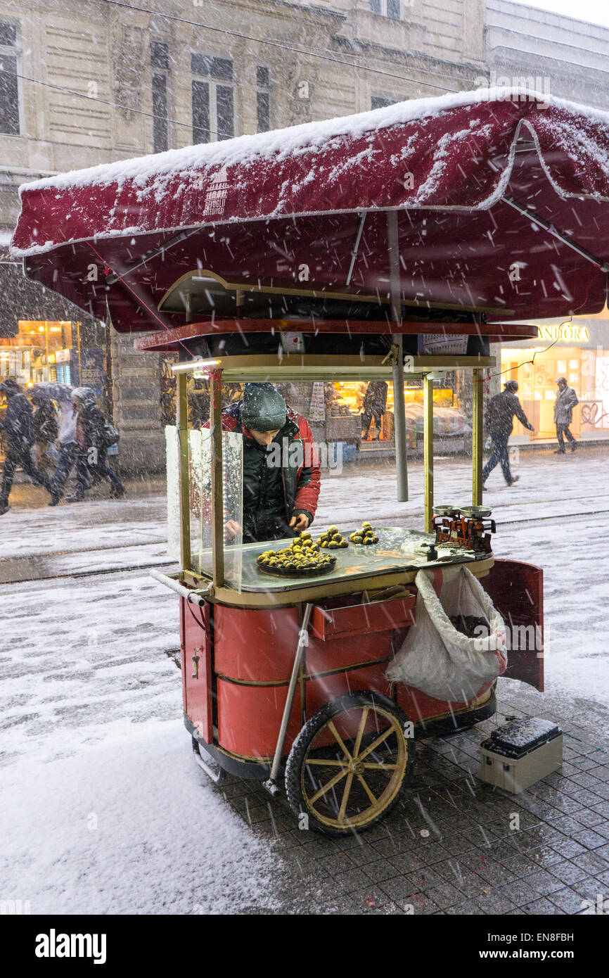 A hot chestnut stall during winter snow storm on Istiklal Caddesi ...