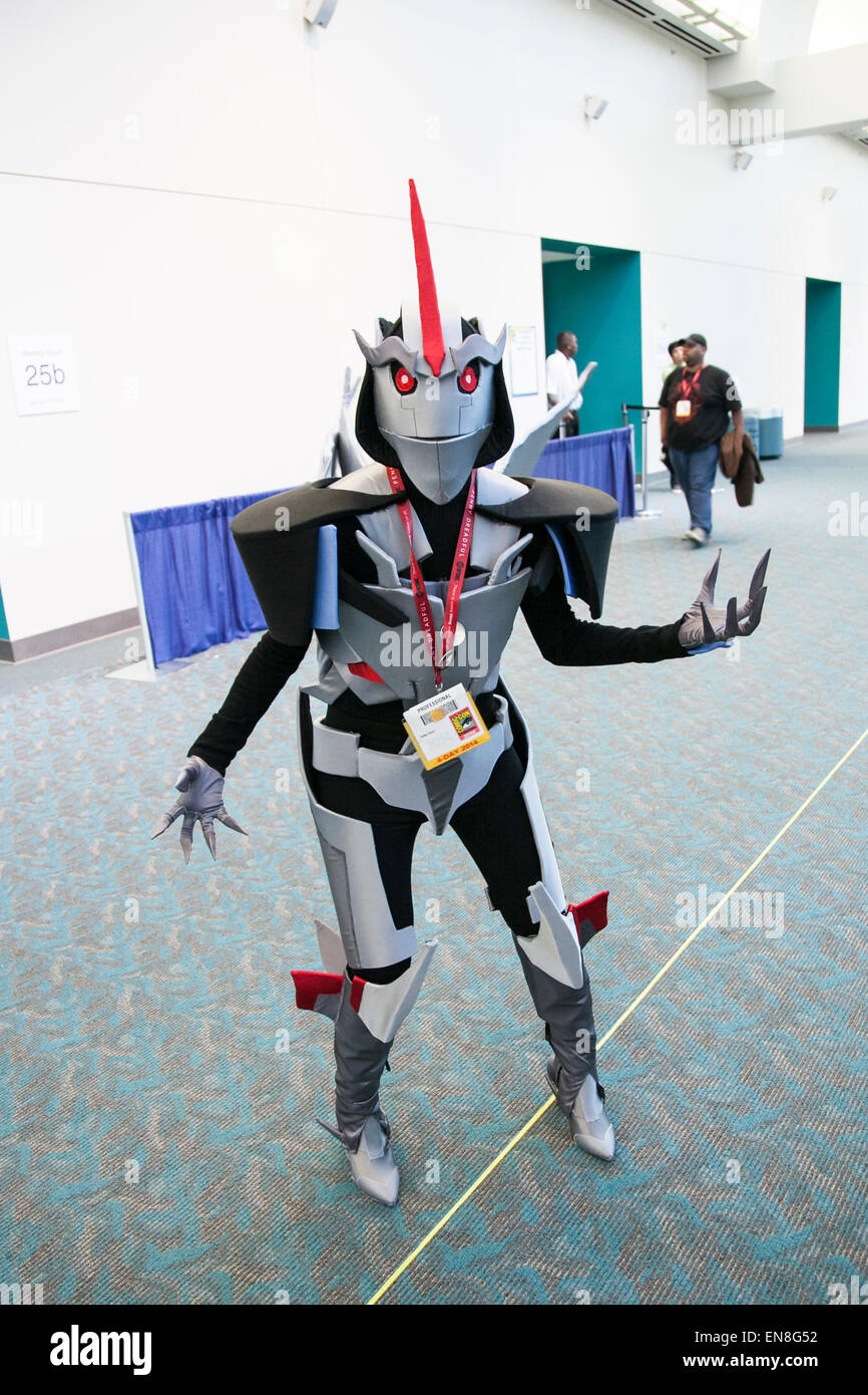A cosplayer wears a homemade Transformers costume outside the panel ...