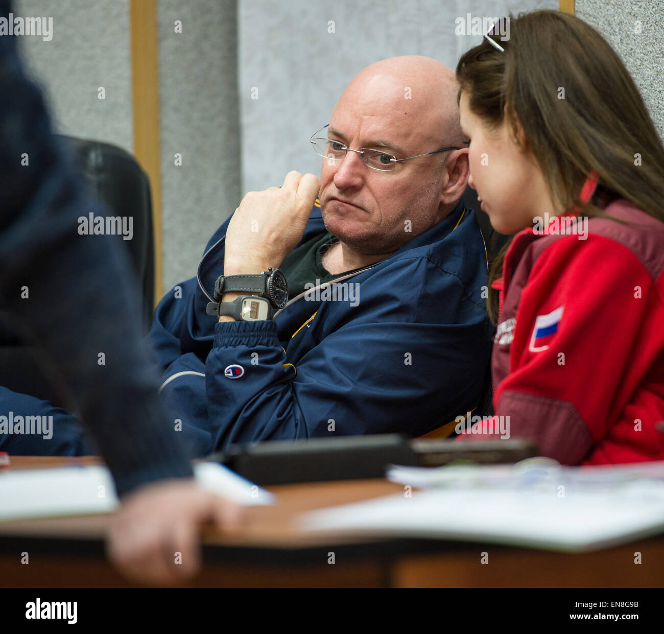 Expedition 43 NASA Astronaut Scott Kelly listens to an interpreter ...