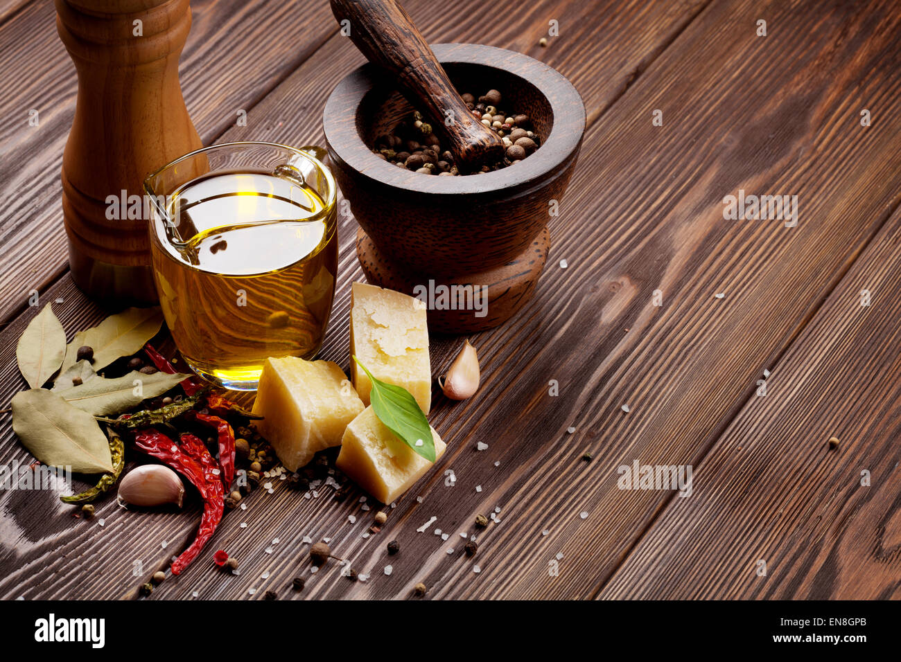 Various spices and condiments on wooden background with copy space ...