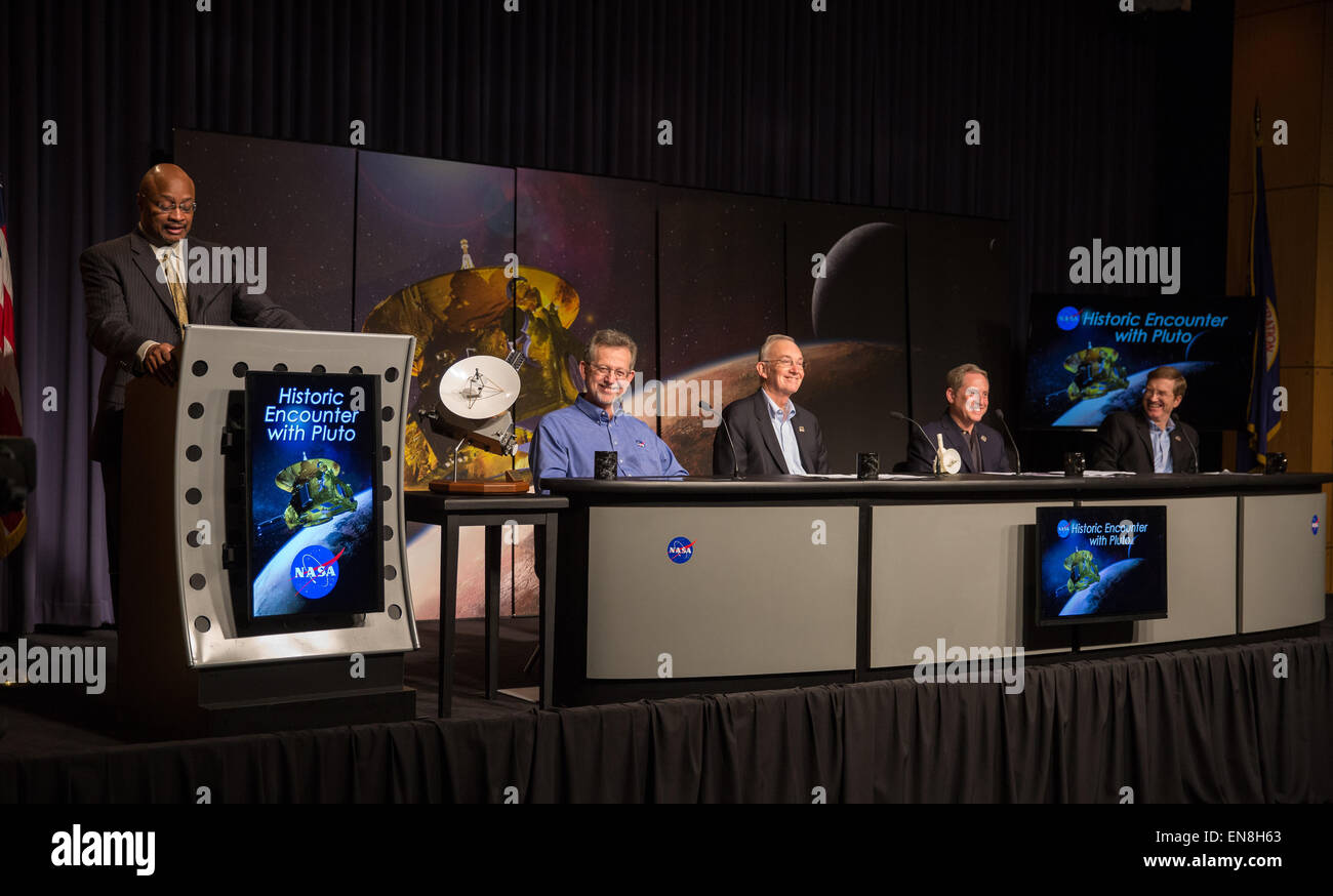 Dwayne Brown, NASA public affairs officer, far left, closes a briefing ...