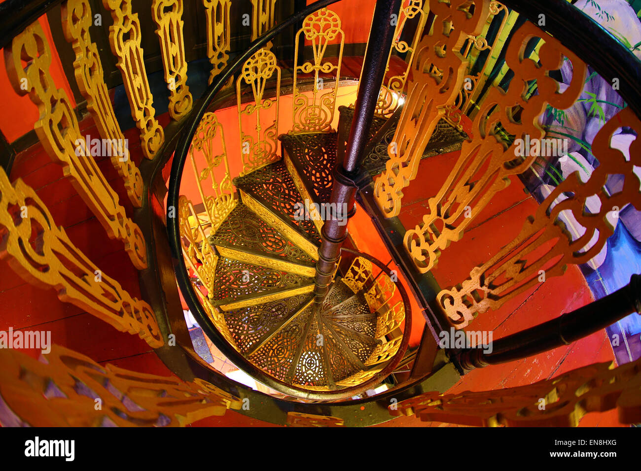 Traditional ironwork spiral staircase in a restaurant in Malacca ...