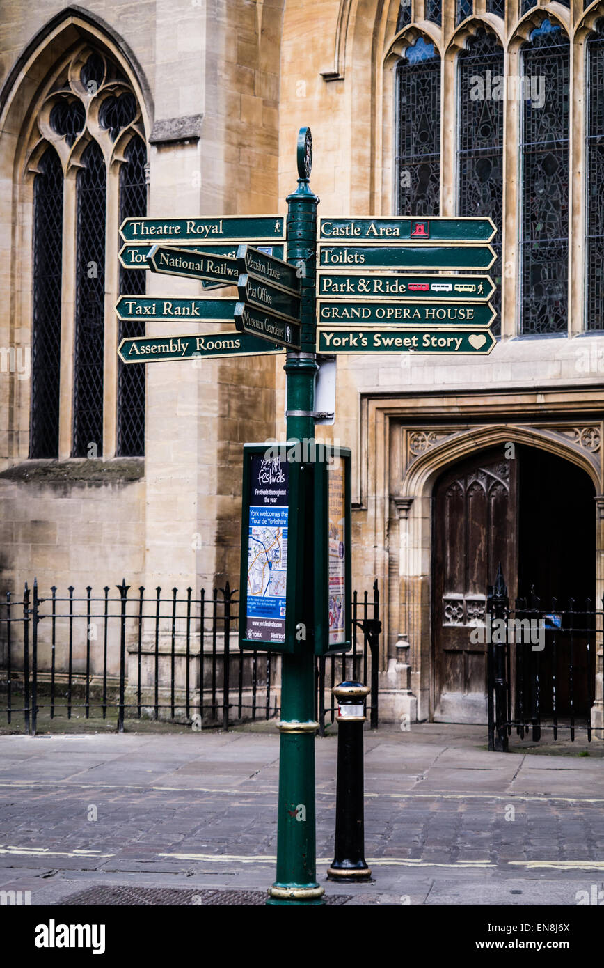 Tourist attractions signpost outside St Helen's Church, Stonegate, York ...