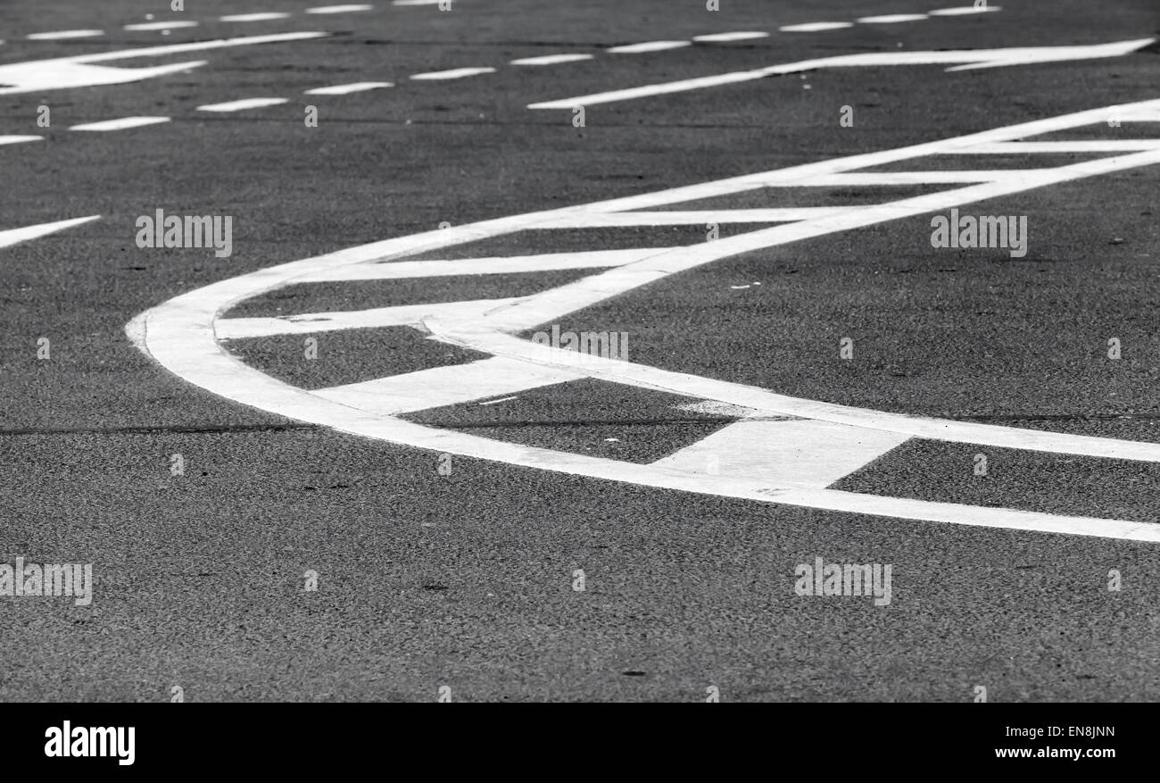 Abstract transportation background. White bent lines over dark gray ...