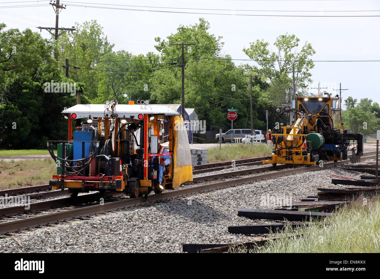 Railroad repair company removing railroad ties and install new ones ...