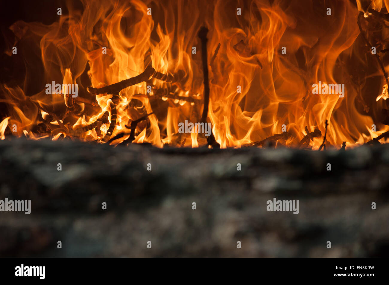 Flames in a raging fire inside a traditional wood fired stone oven ...