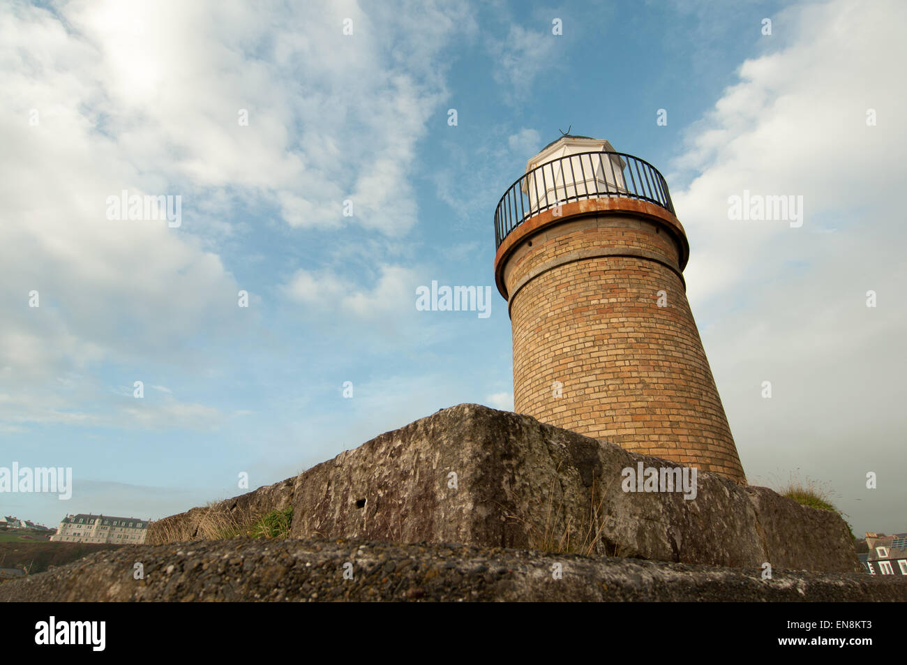 PortPatrick lighthouse taken from the village harbour, with blue skies ...