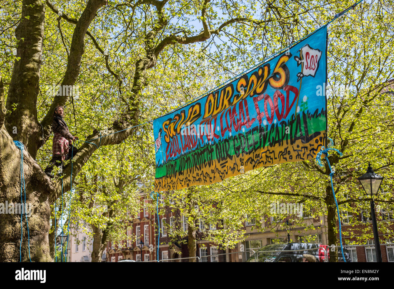 Bristol, UK. 29th April, 2015. Protesters climbed trees to put up a ...