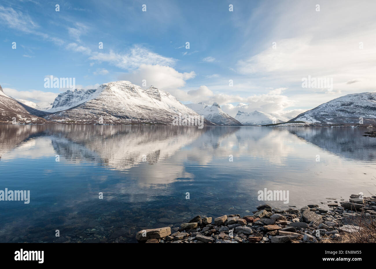 Mountains reflecting on water, Lyngen Alps, arctic Norway Stock Photo ...