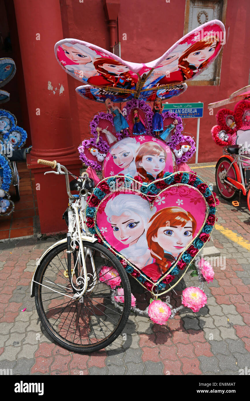 Decorated kitsch cycle trishaw rickshaw with soft toys in Malacca ...