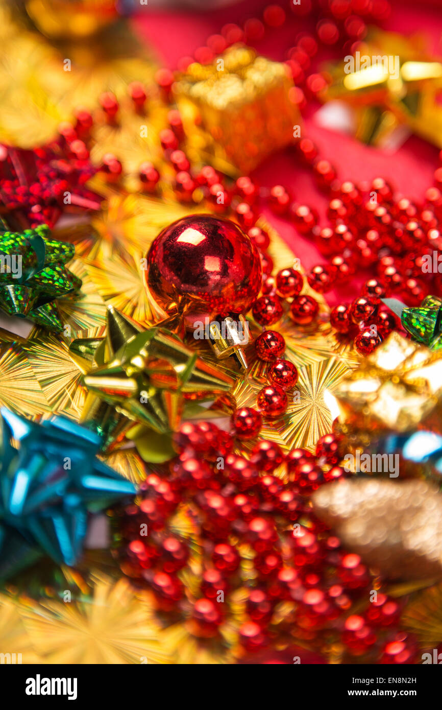 small red ball near golden gift-box red bead and bow close-up Stock ...