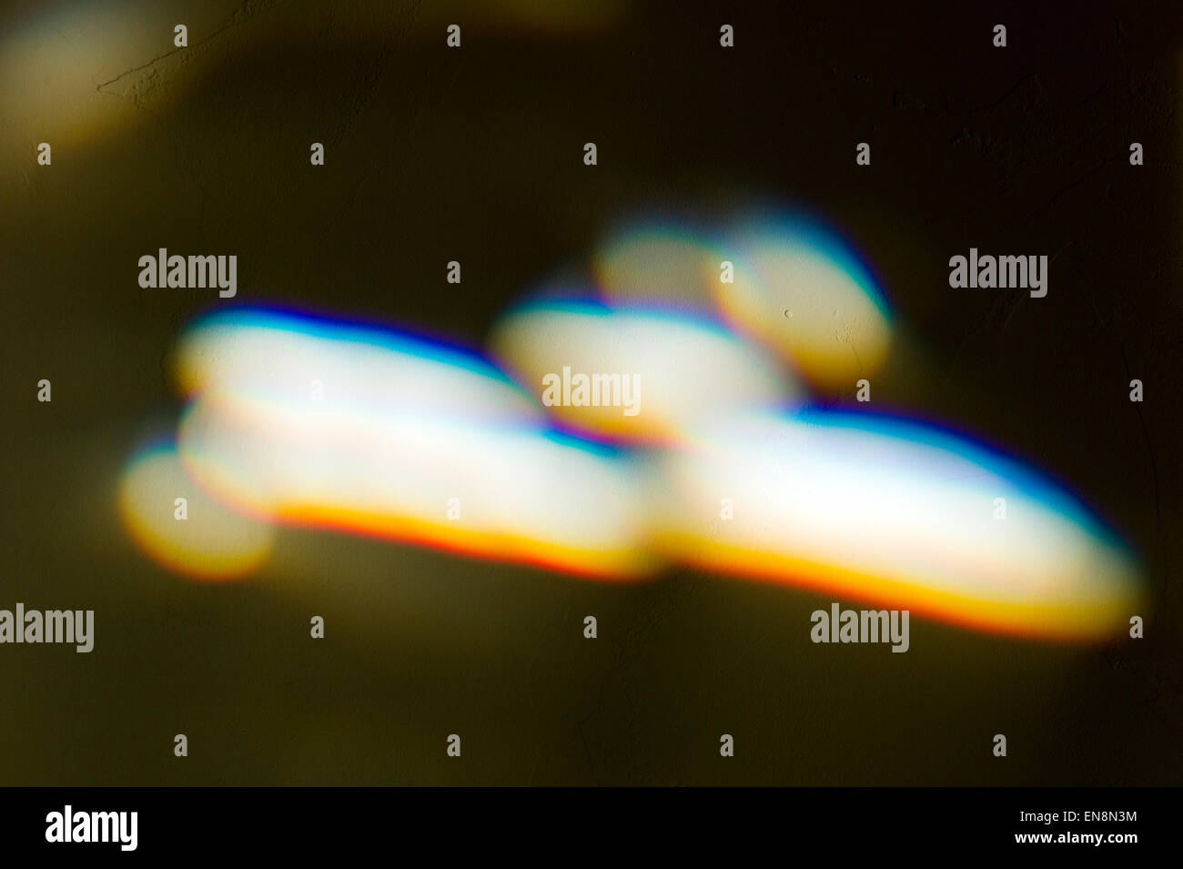 Late day sunlight refracted through a stained, leaded glass window ...