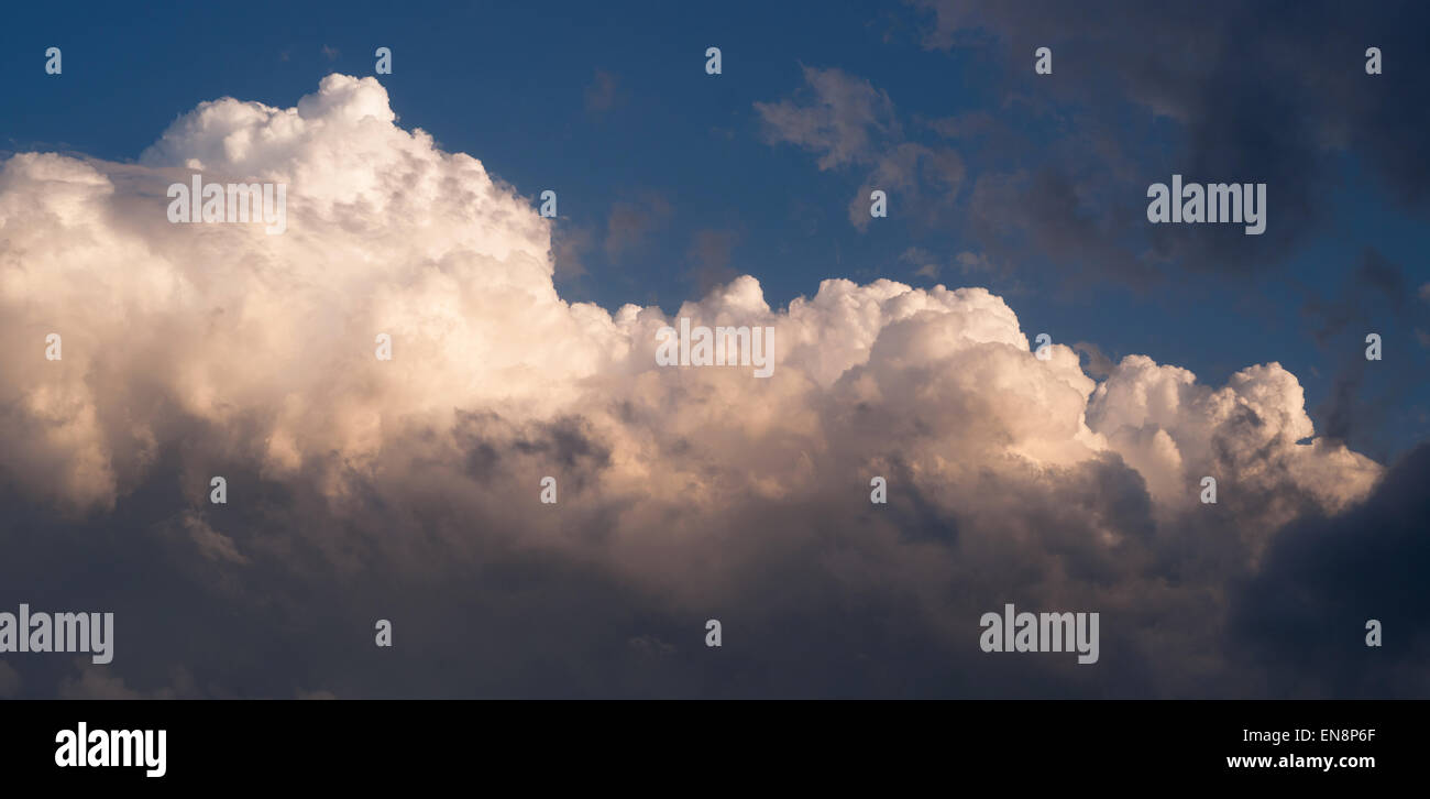 Rolling clouds filled with light right before sunset Stock Photo - Alamy