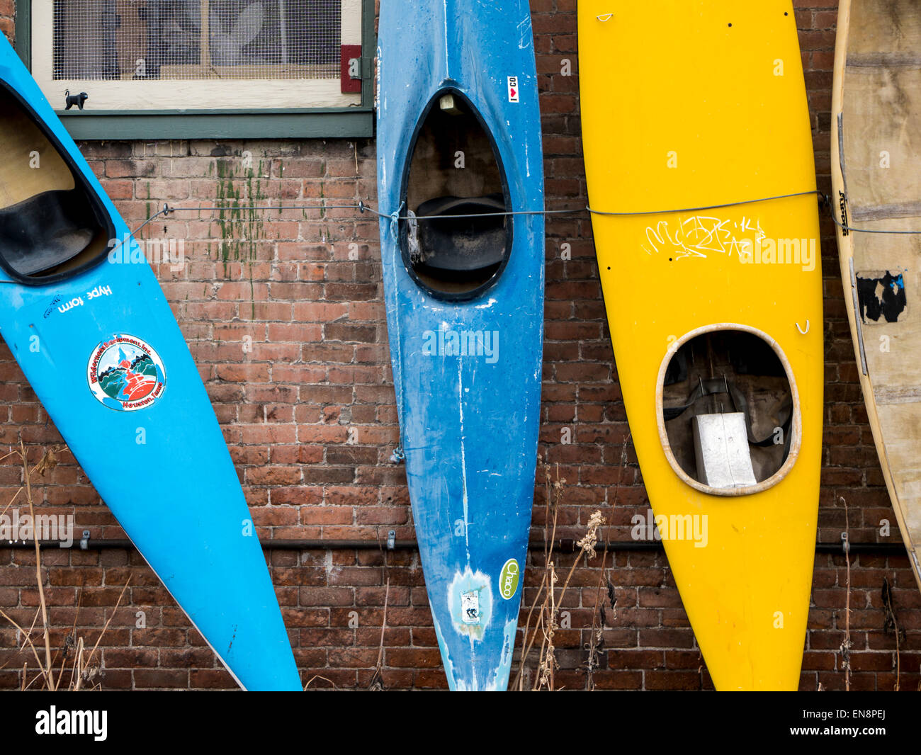 Old kayaks on display outside Capricorn Kayaks, downtown historic ...
