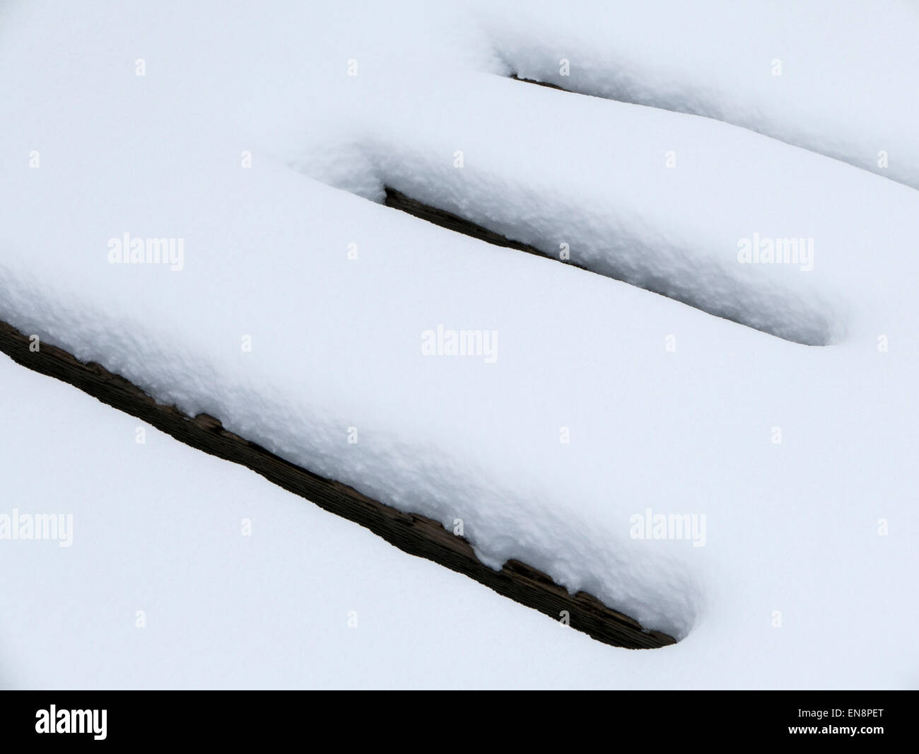 Snow creates patterns on old rail structure Stock Photo - Alamy