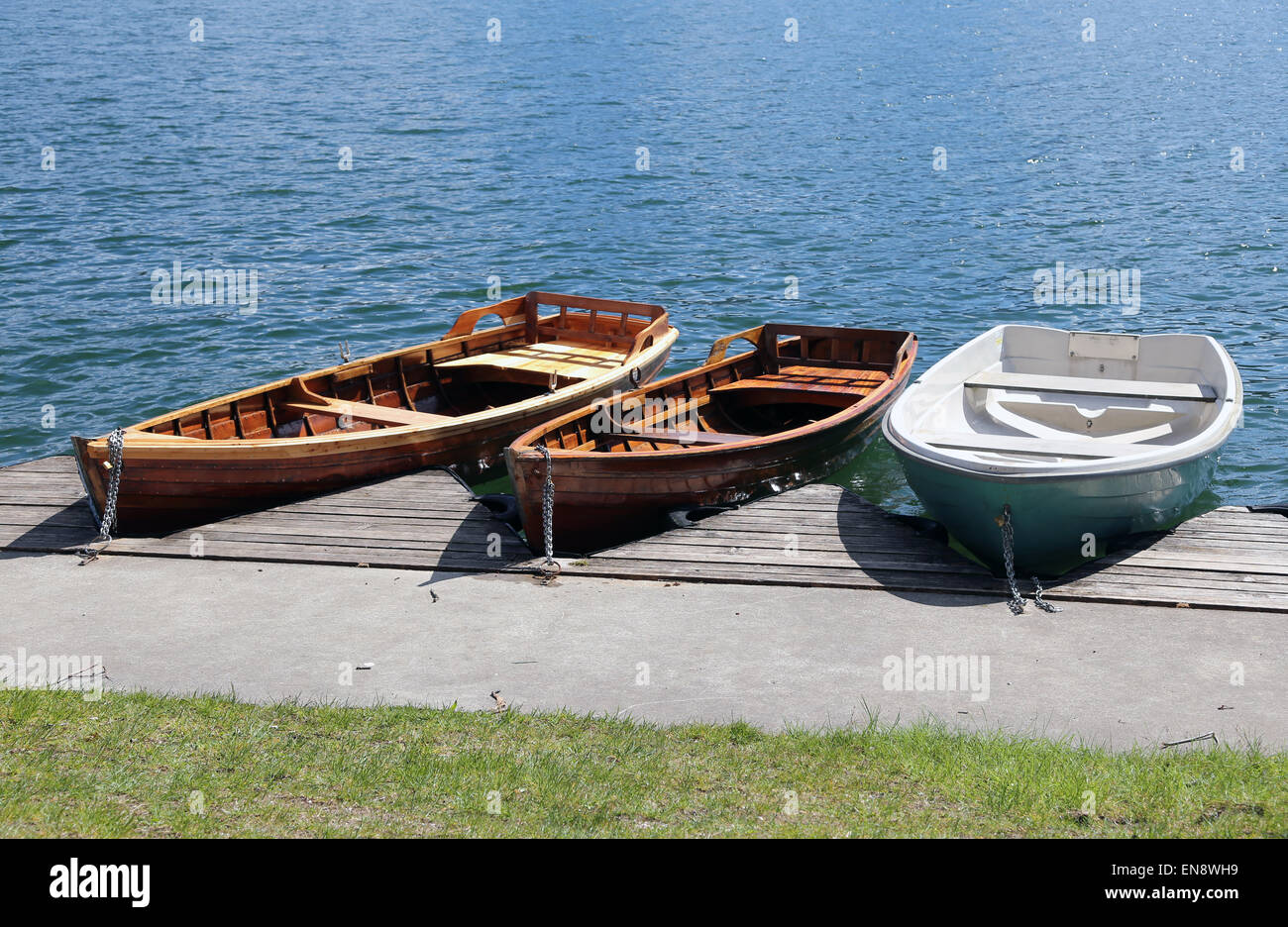 three rowboats moored on the shore of Little Lake Stock Photo - Alamy