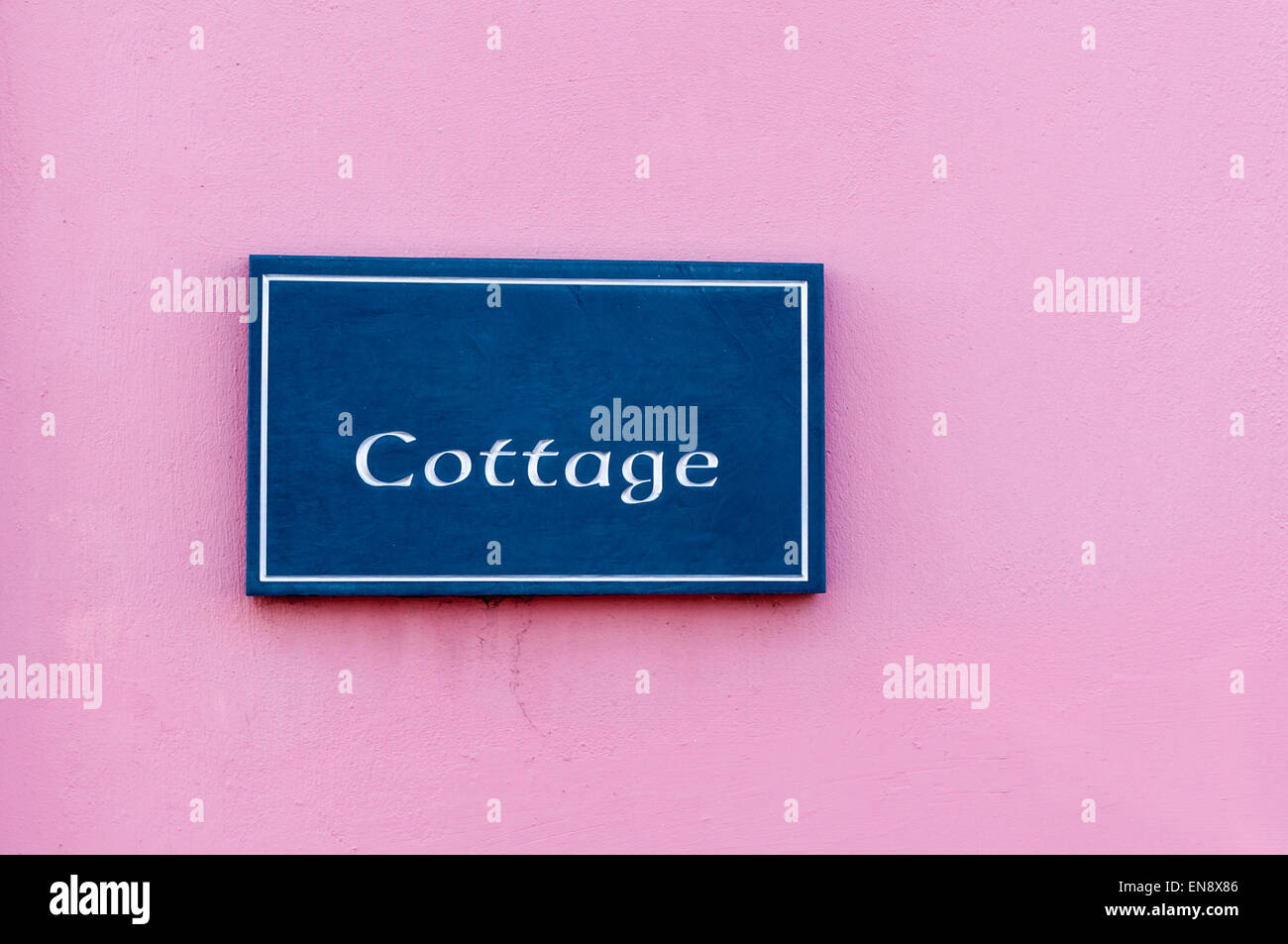 Sign for 'Cottage' engraved on a tile pasted on wall Stock Photo - Alamy
