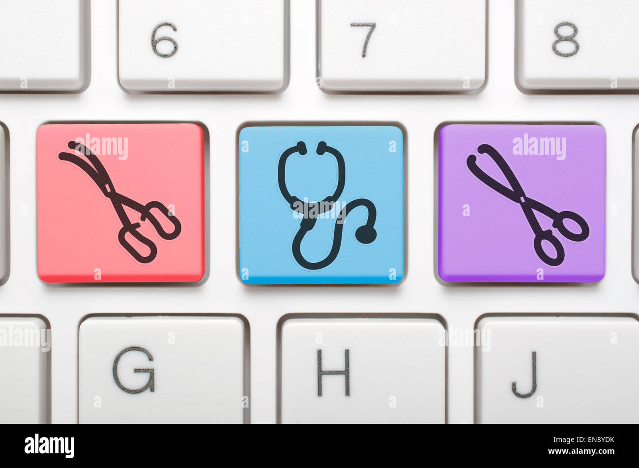 Stethoscope and medical scissors key on keyboard Stock Photo - Alamy