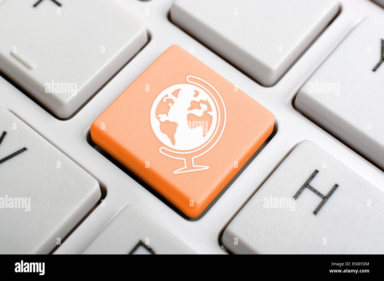 Brown earth key on keyboard Stock Photo - Alamy
