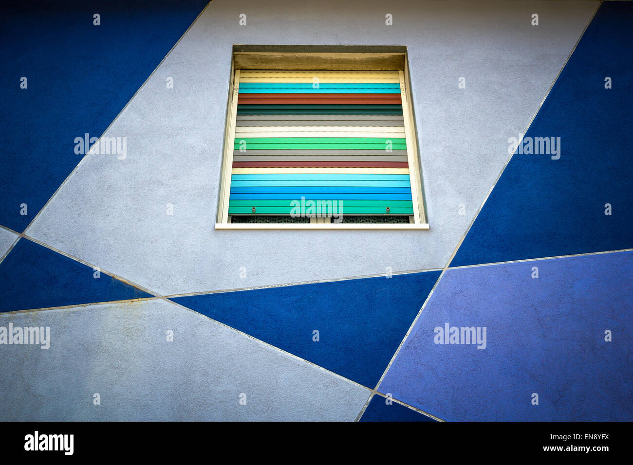 A colored window and a wall made 70's style Stock Photo - Alamy