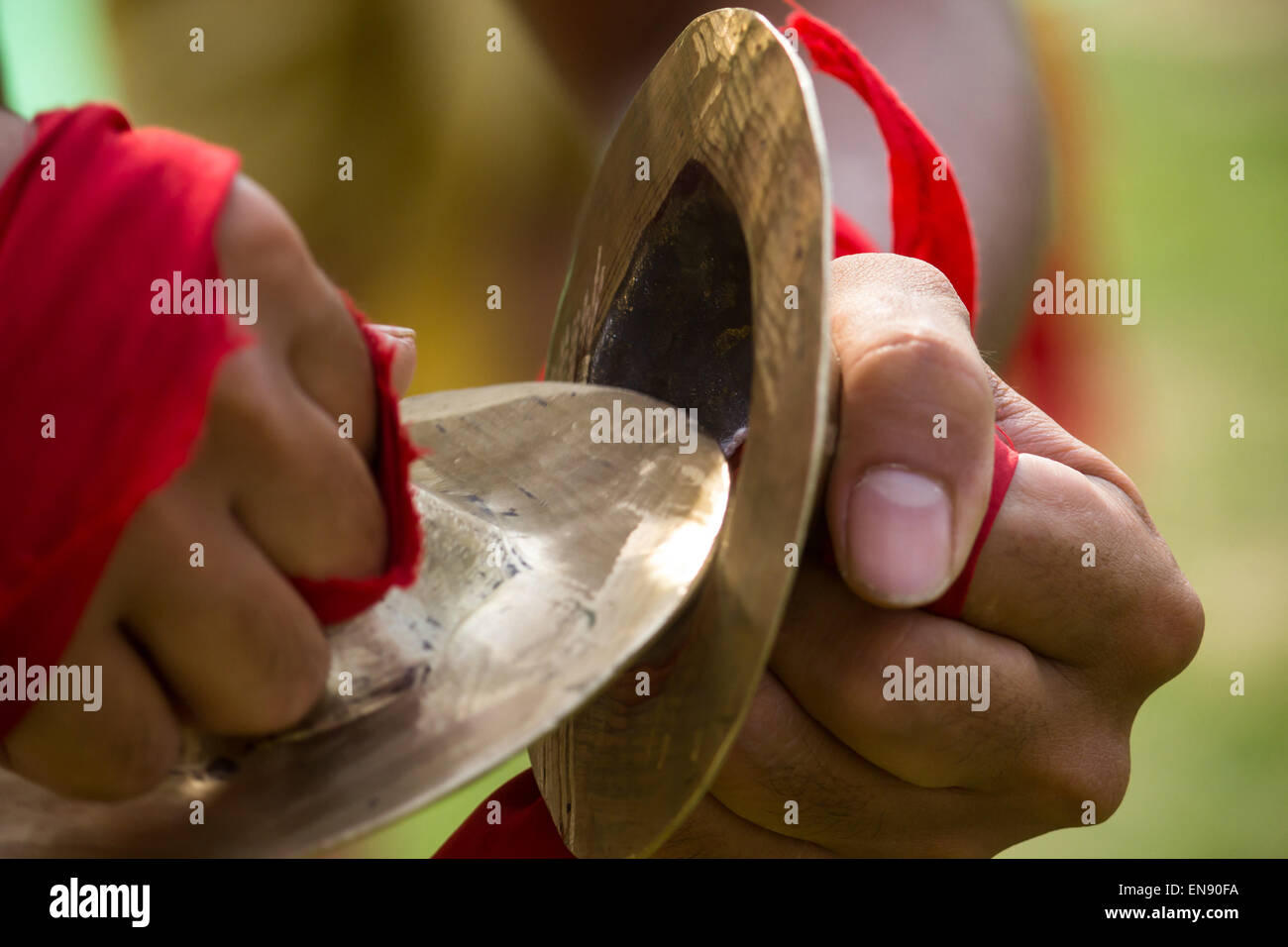 Sivasagar, Assam, India. 30th Apr, 2015. An Indian youth plays a pair ...