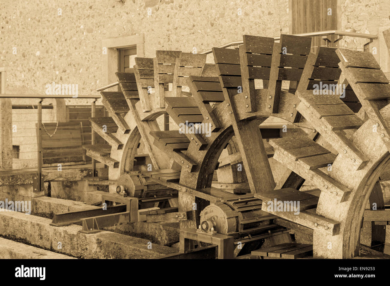 Effect vintage.Series of three wheeled wooden mill renovated Stock ...