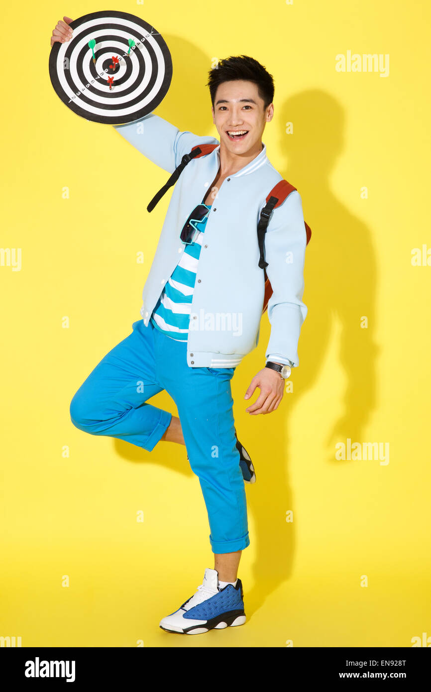 Young man holding shield hi-res stock photography and images - Alamy