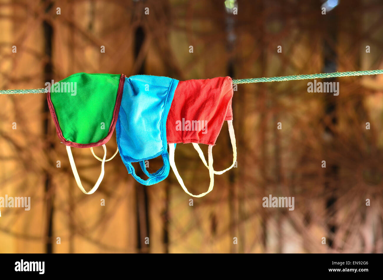 many mask hanging on the rope Stock Photo - Alamy