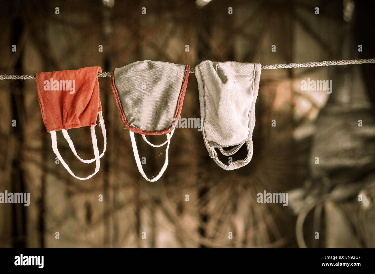 mask hanging on the rope in old light Stock Photo - Alamy