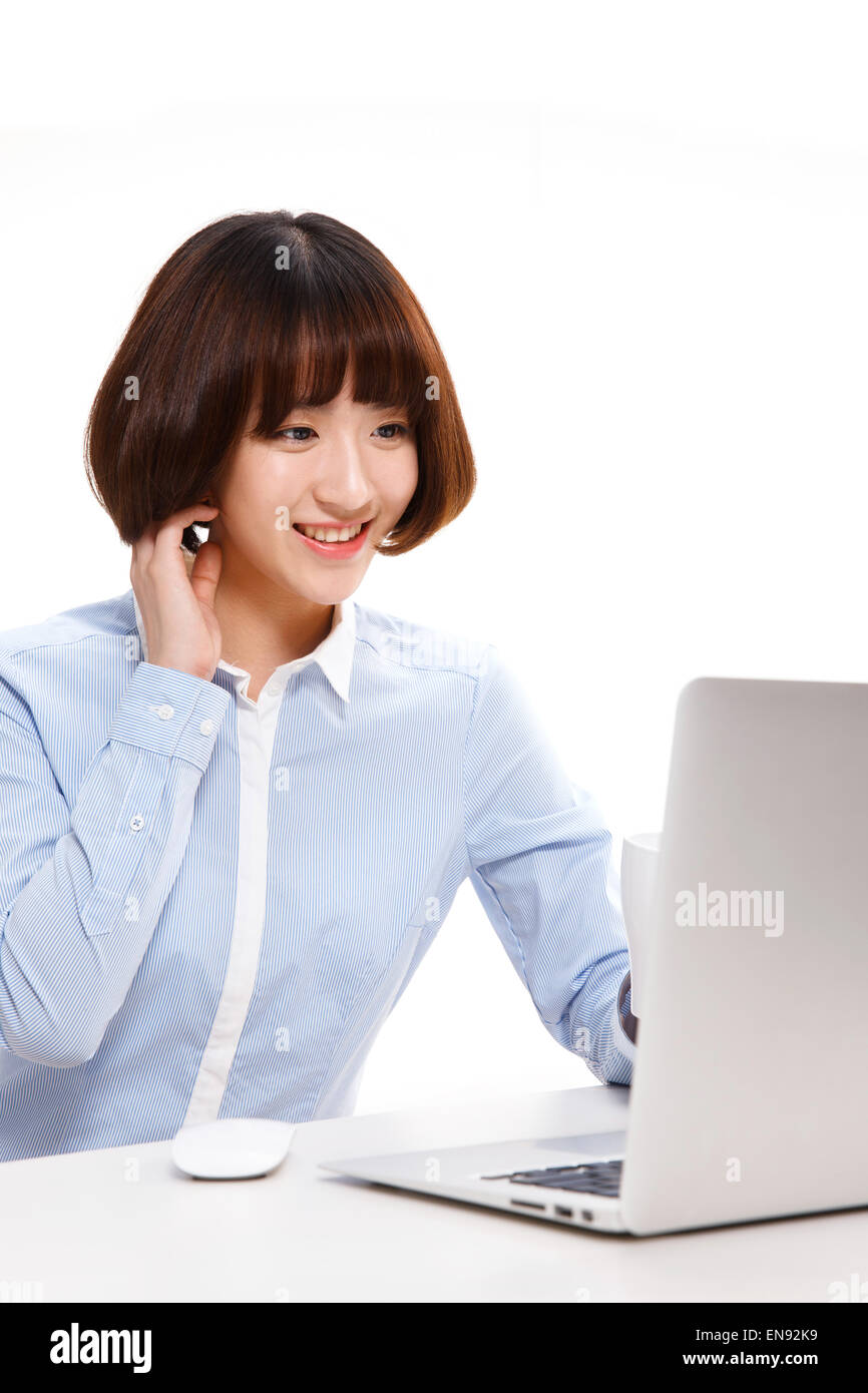 The young woman to use the computer in the Office Stock Photo - Alamy