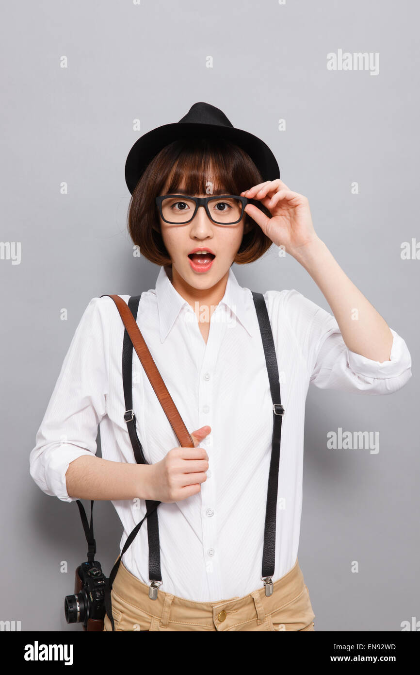 Beautiful young woman with a camera Stock Photo - Alamy