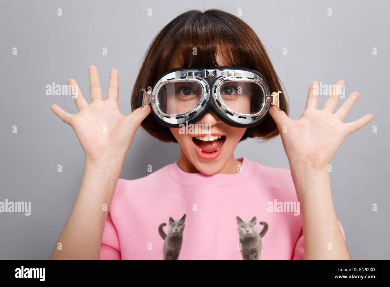 Beautiful young woman wearing protective hi-res stock photography and ...