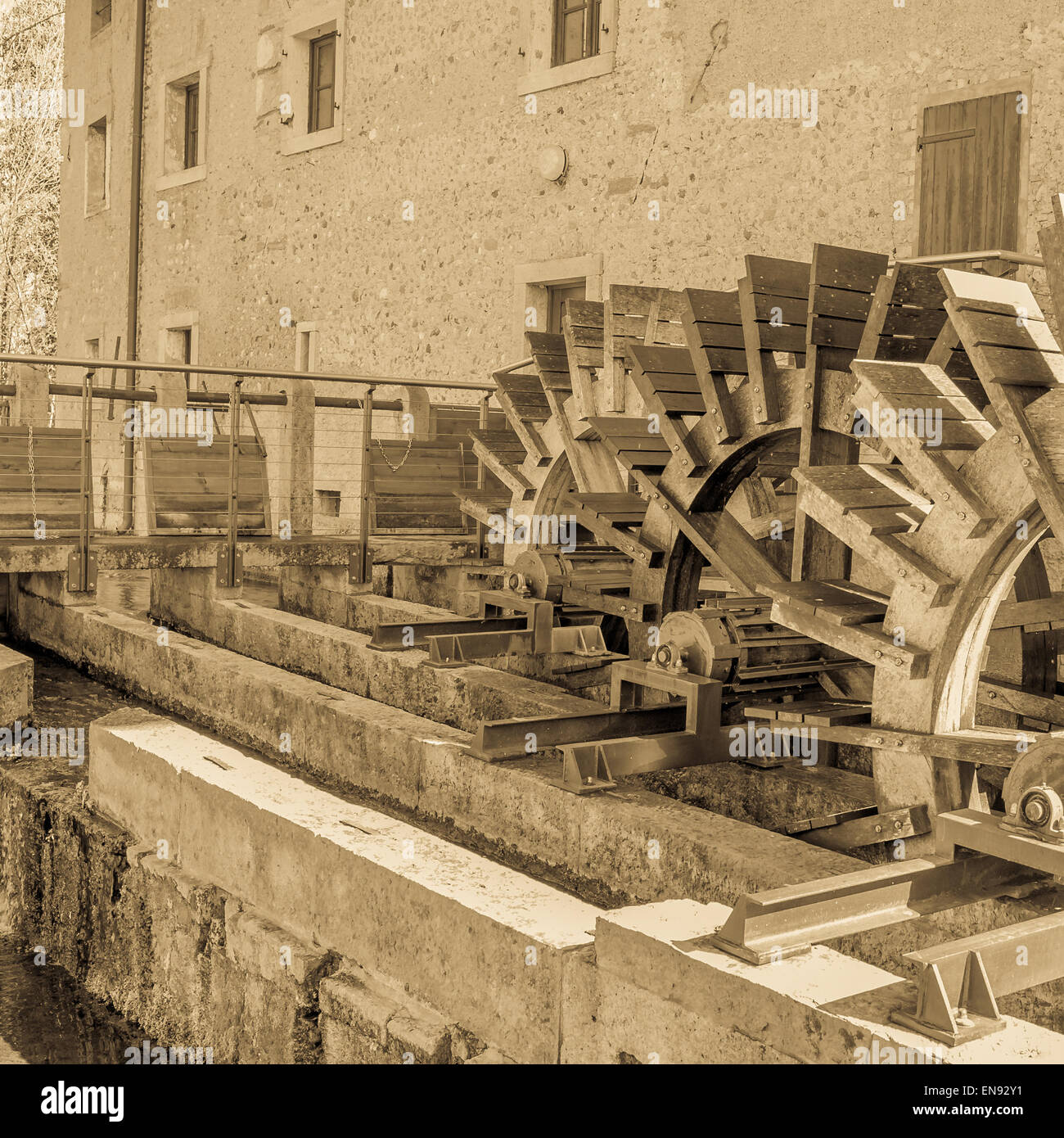 Effect vintage.Series of three wheeled wooden mill renovated Stock ...