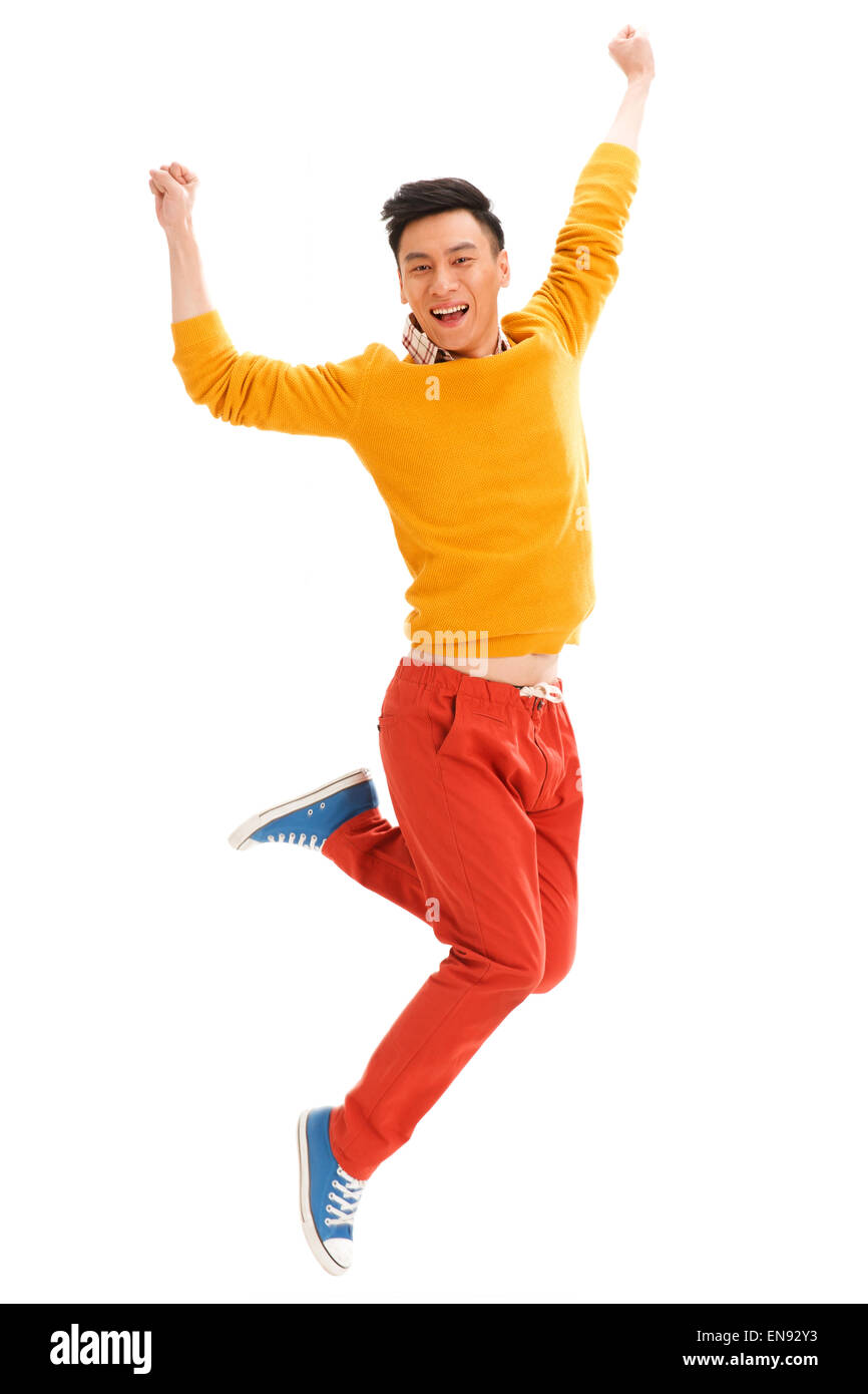 Fashionable young guy jump Stock Photo - Alamy
