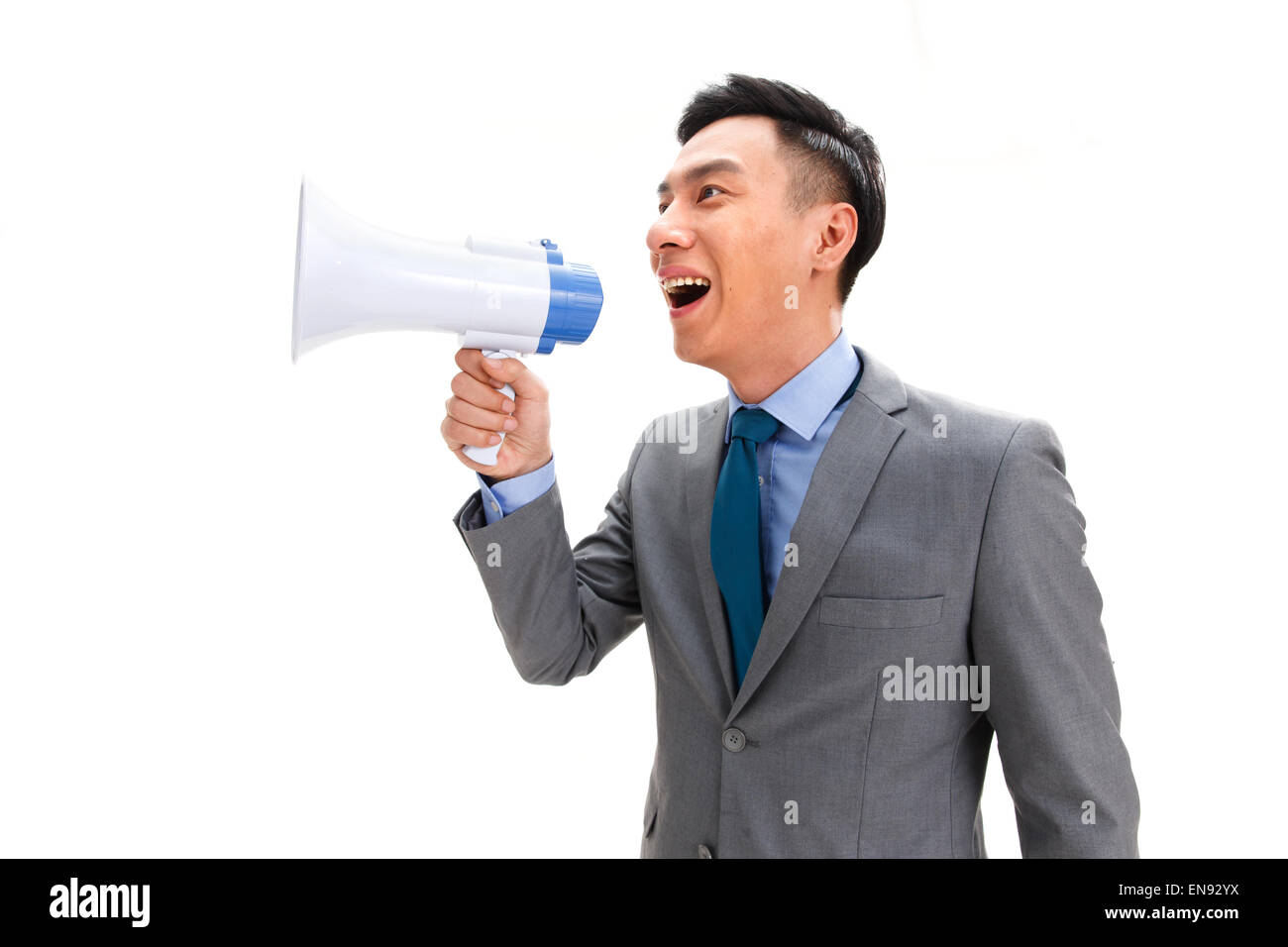 The young man took the microphone to shout Stock Photo - Alamy