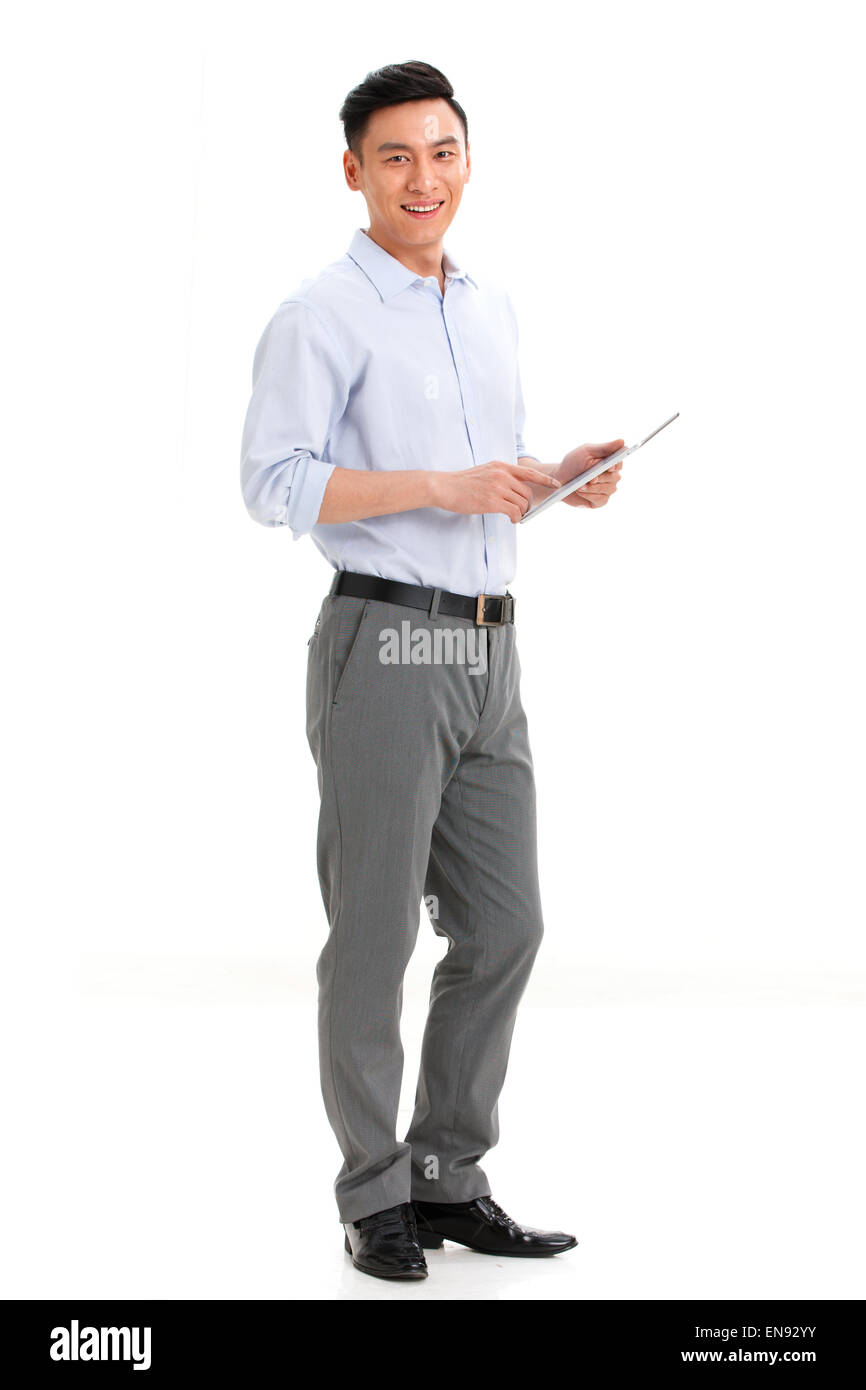 The young guy took the tablet computer Stock Photo - Alamy