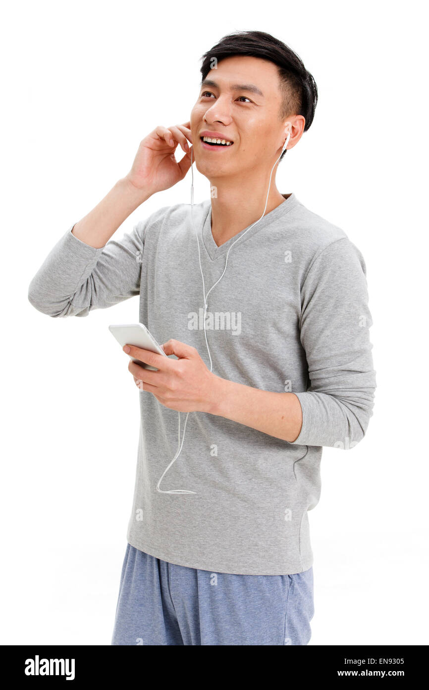 Handsome young man to listen to music Stock Photo - Alamy