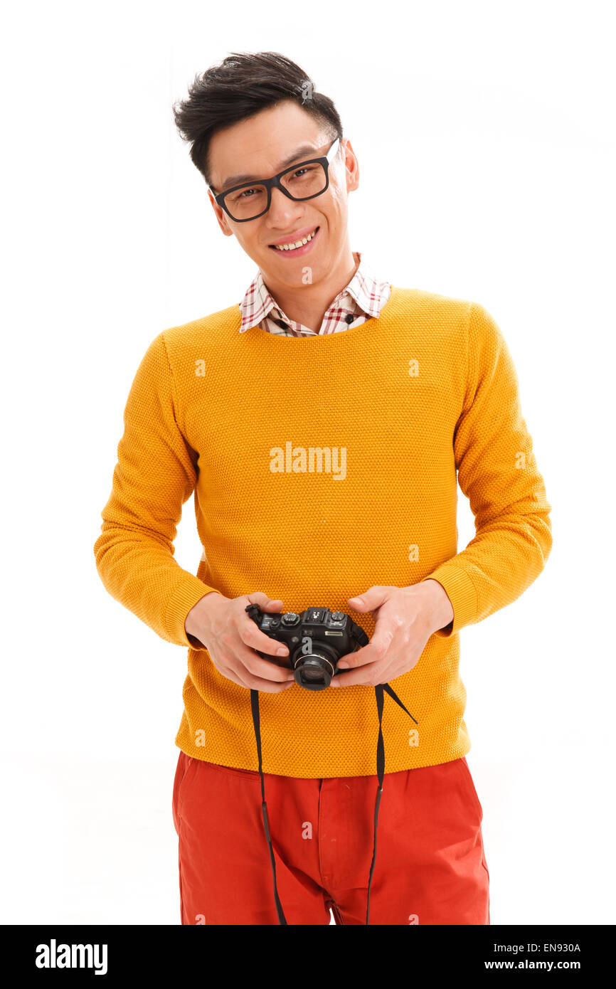 Young guy holding a camera Stock Photo - Alamy